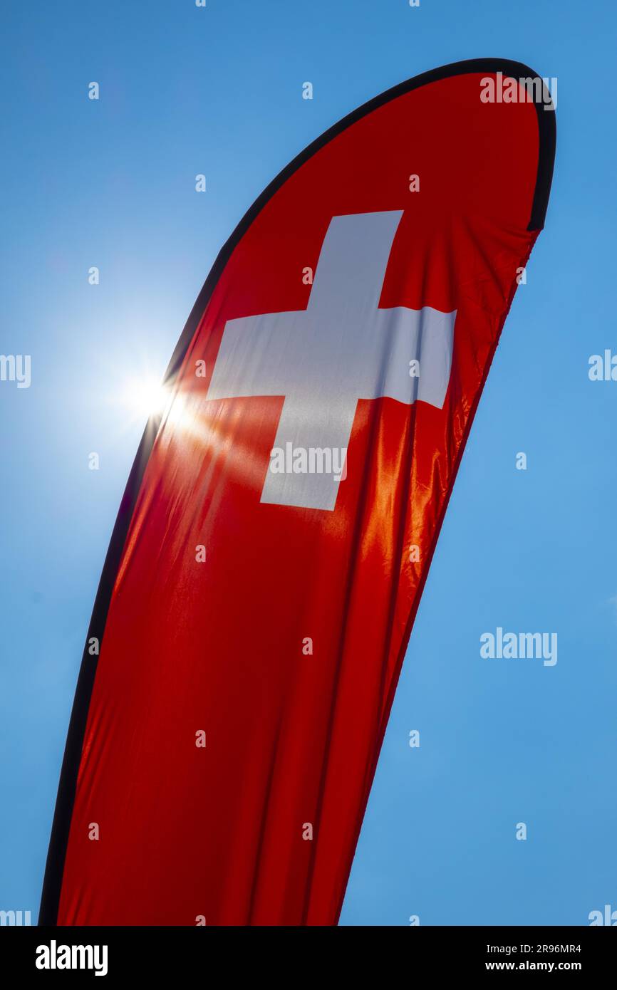 Swiss Banner Flag with Sunlight and Against Blue Sky in Switzerland ...