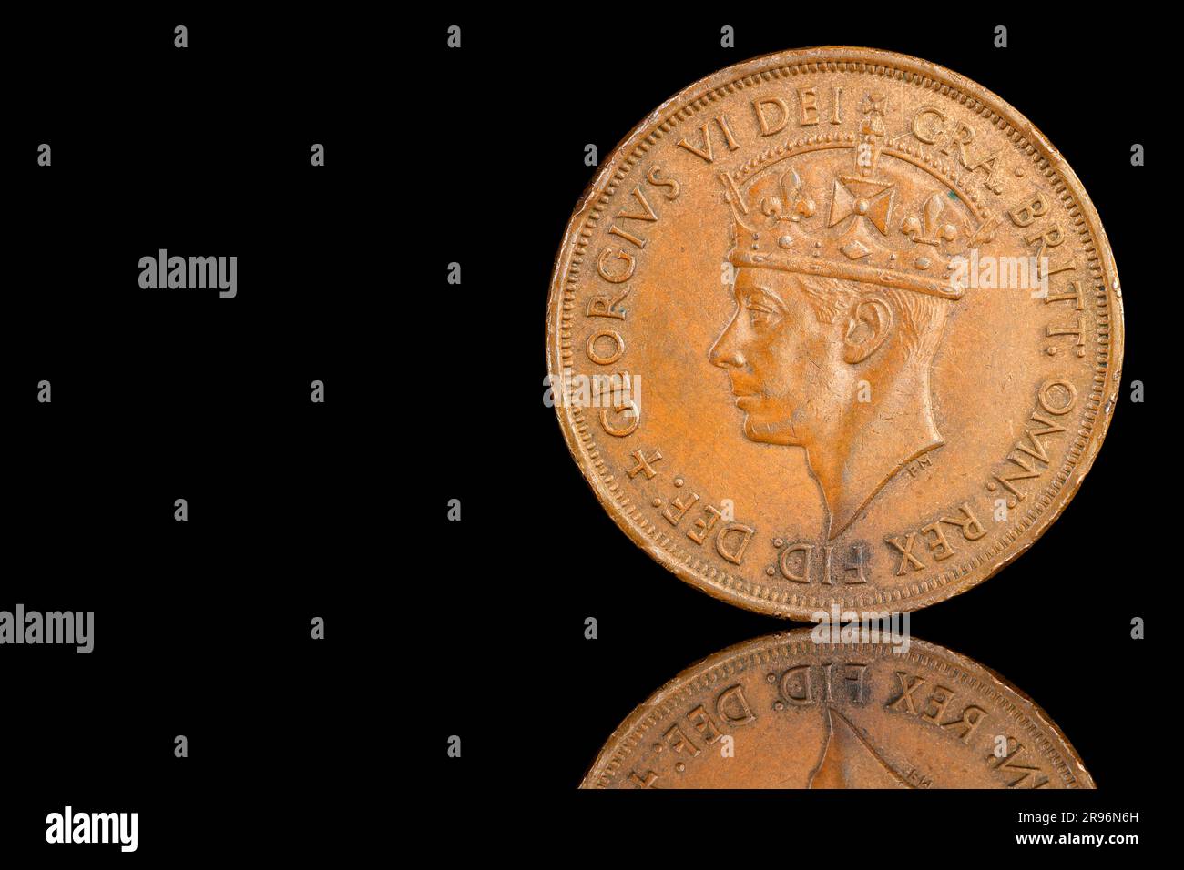 1945 one twelth of a shilling featuring a crowned portrait of George VI ...