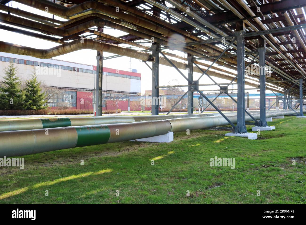 Pipeline overpass with iron rusty pipes for pumping liquid, condensate ...
