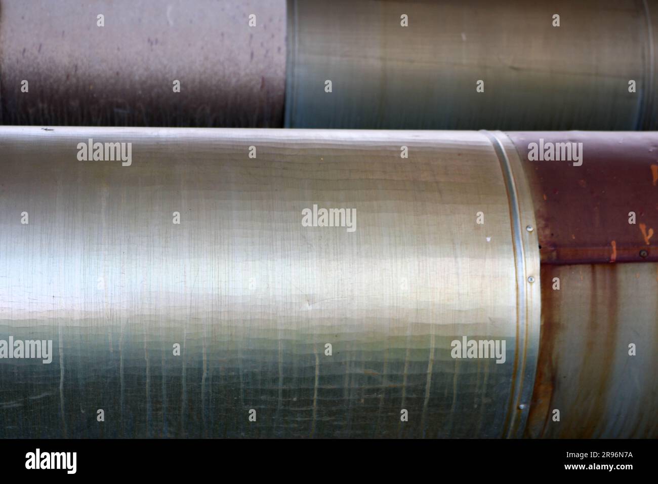Two large pipes in isolation from tin on the oil refinery ...
