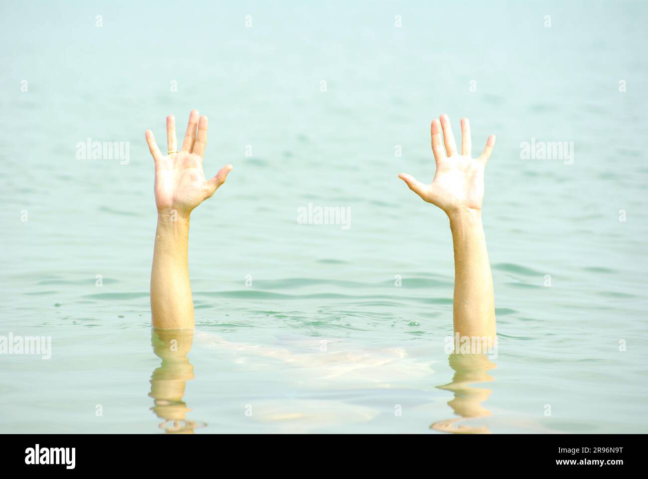 Man in the sea, hands up, drowning, drowning Stock Photo - Alamy