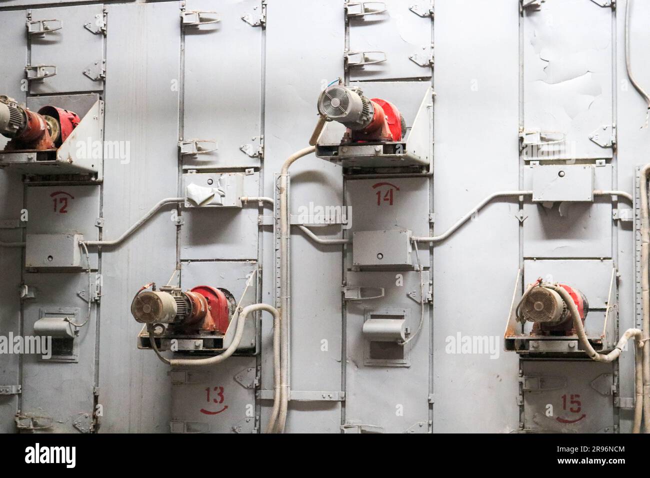 Many industrial metal asynchronous electric motors in the iron gray ...