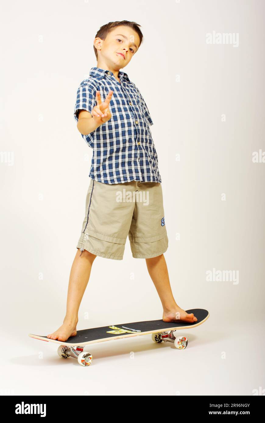 Boy on skateboard, skate, victory sign, cutout, cutoutable Stock Photo ...