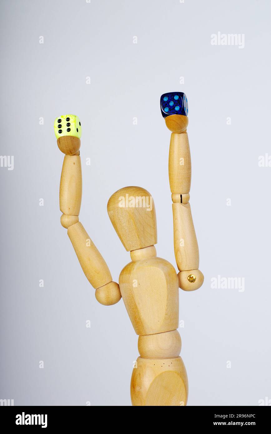 Wooden figure with dice, dice, dice, balance, balance Stock Photo - Alamy