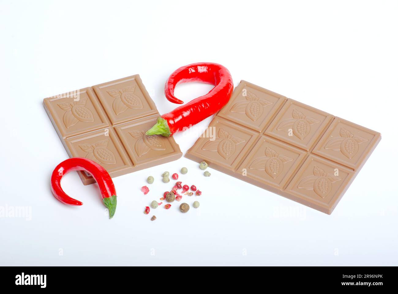 Bar of light chocolate with peperonis, peppercorns (Capsicum annuum ...