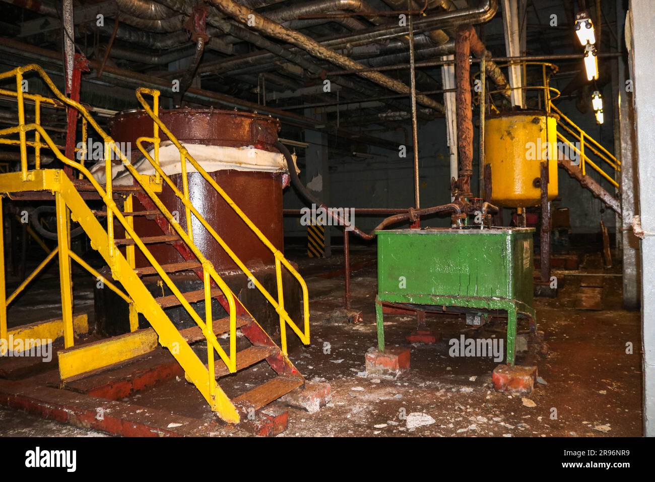 Stairs with steps and shelves with railings and equipment tanks at the ...