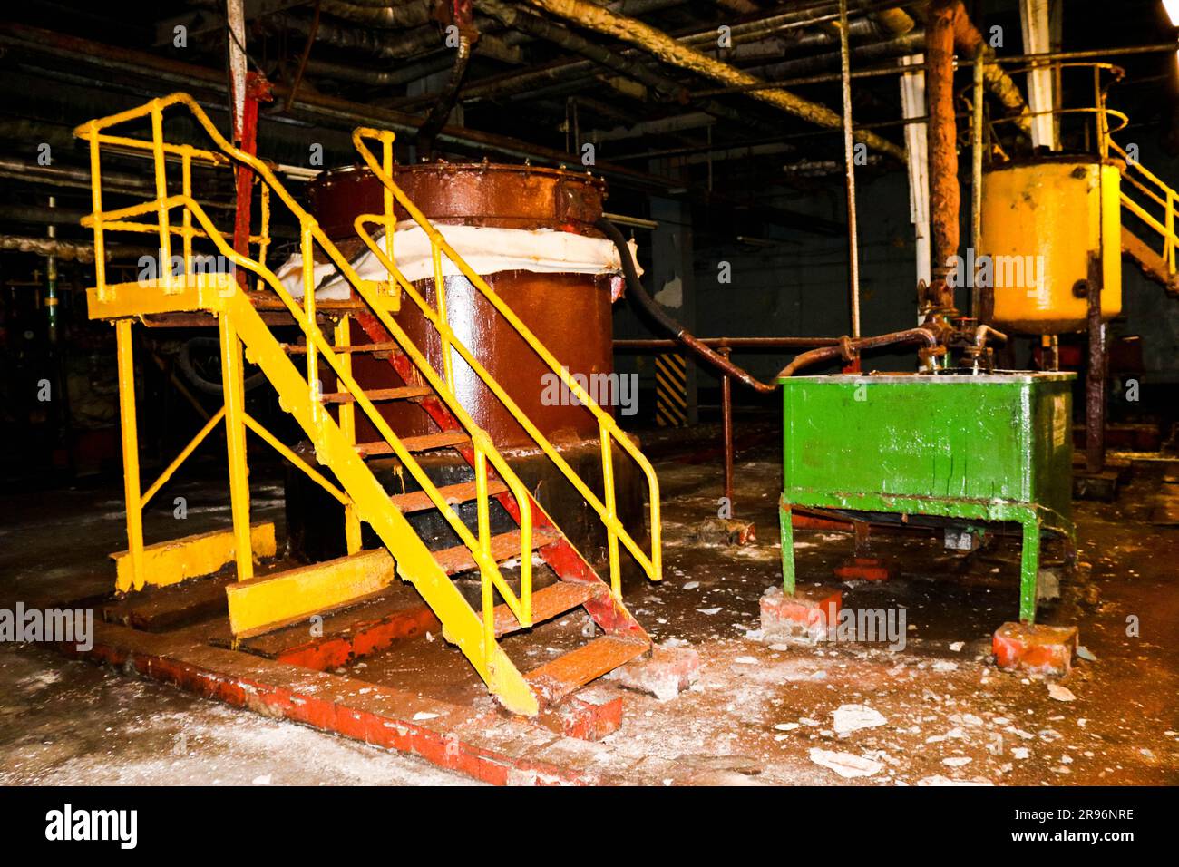 Stairs with steps and shelves with railings and equipment tanks at the ...