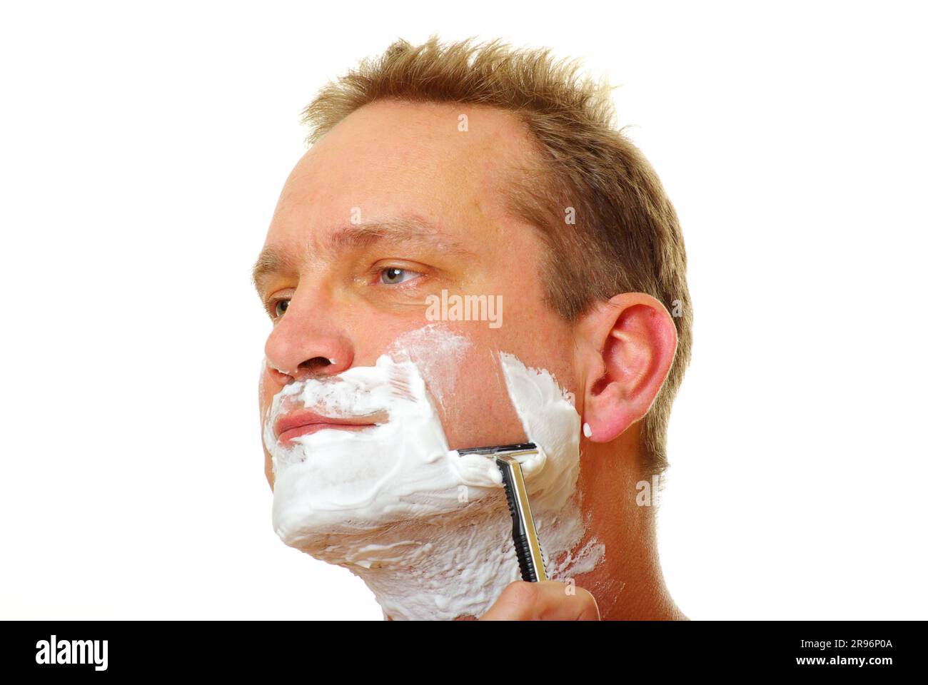 one wet shaving razor and some foam in a face Stock Photo - Alamy