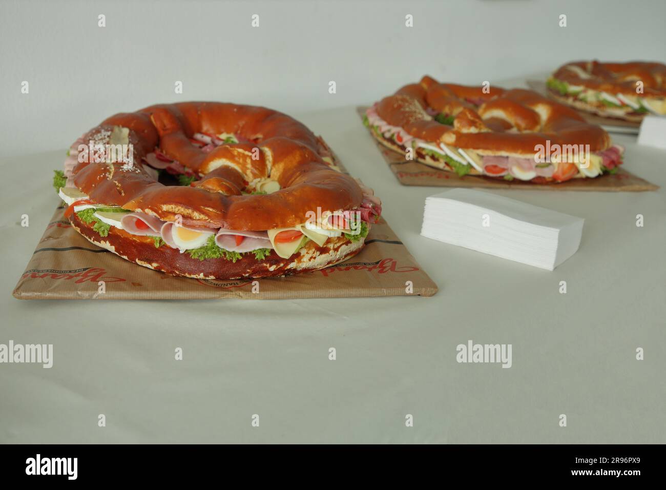 Large pretzel with cheese and sausage, sandwich, savoury biscuits ...