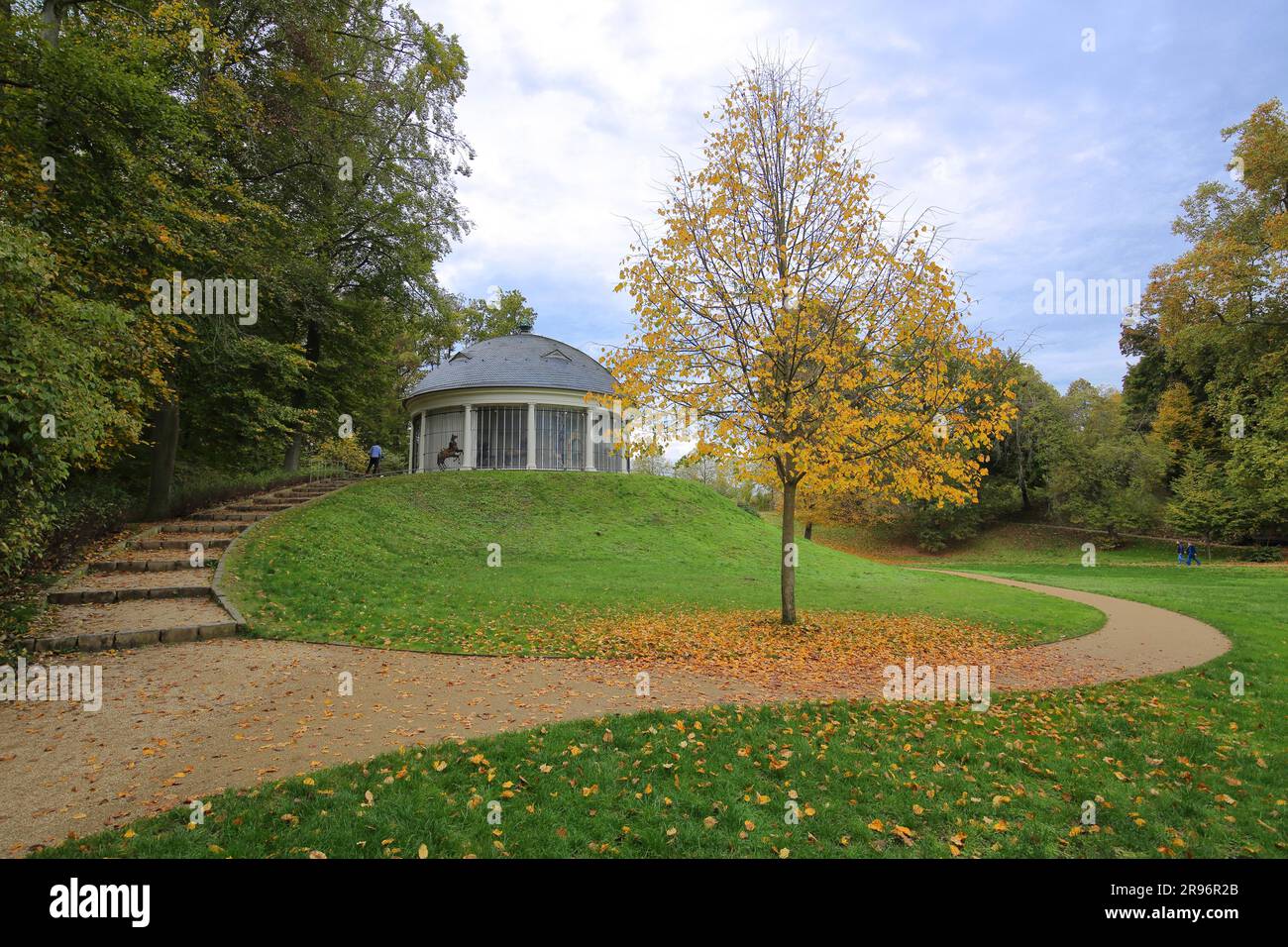 View of historic carousel with dome in Wilhelmsbad State Park, walkway ...
