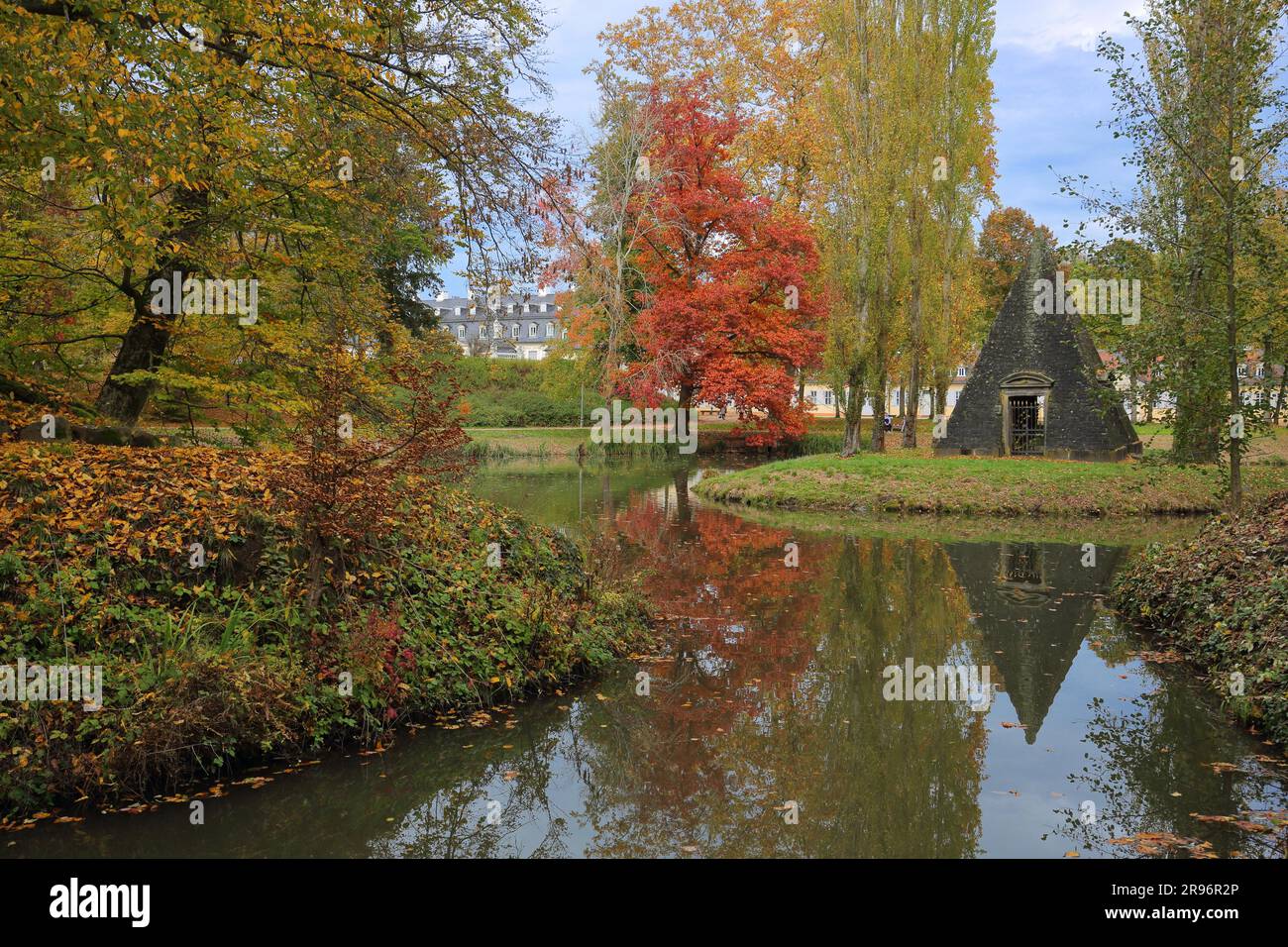 Pyramid at the pond during autumn with reflection, park, forest ...
