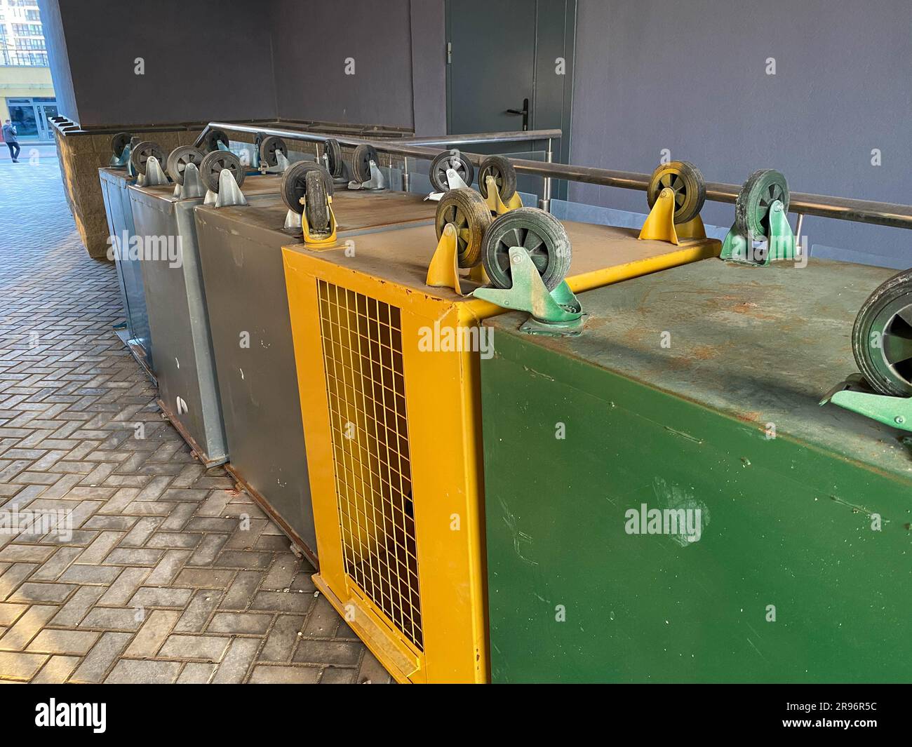 Large iron upside down clean empty iron bins with wheels to separate ...