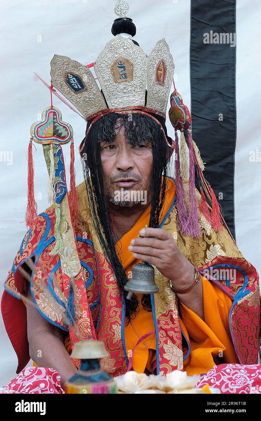 Buddhist man with headdress, Pokhara, Nepal Stock Photo - Alamy