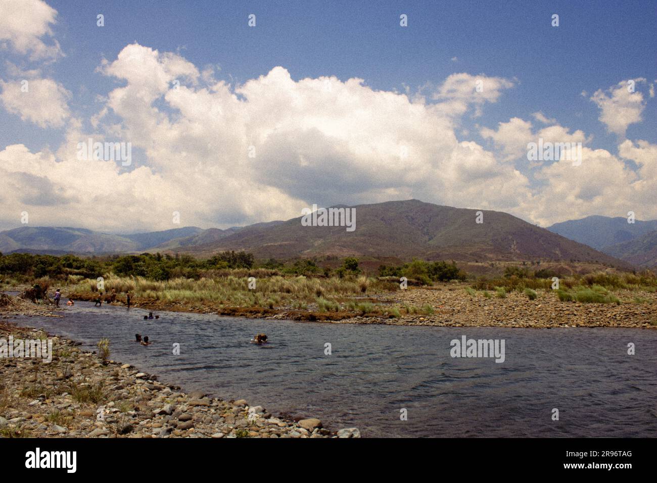 People swimming and playing in a river in Iba, Philippines Stock Photo ...