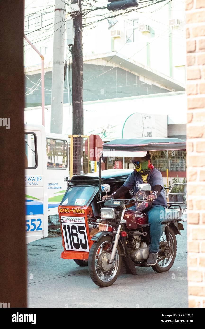 Person driving a tricycle in Olongapo, Philippines Stock Photo - Alamy