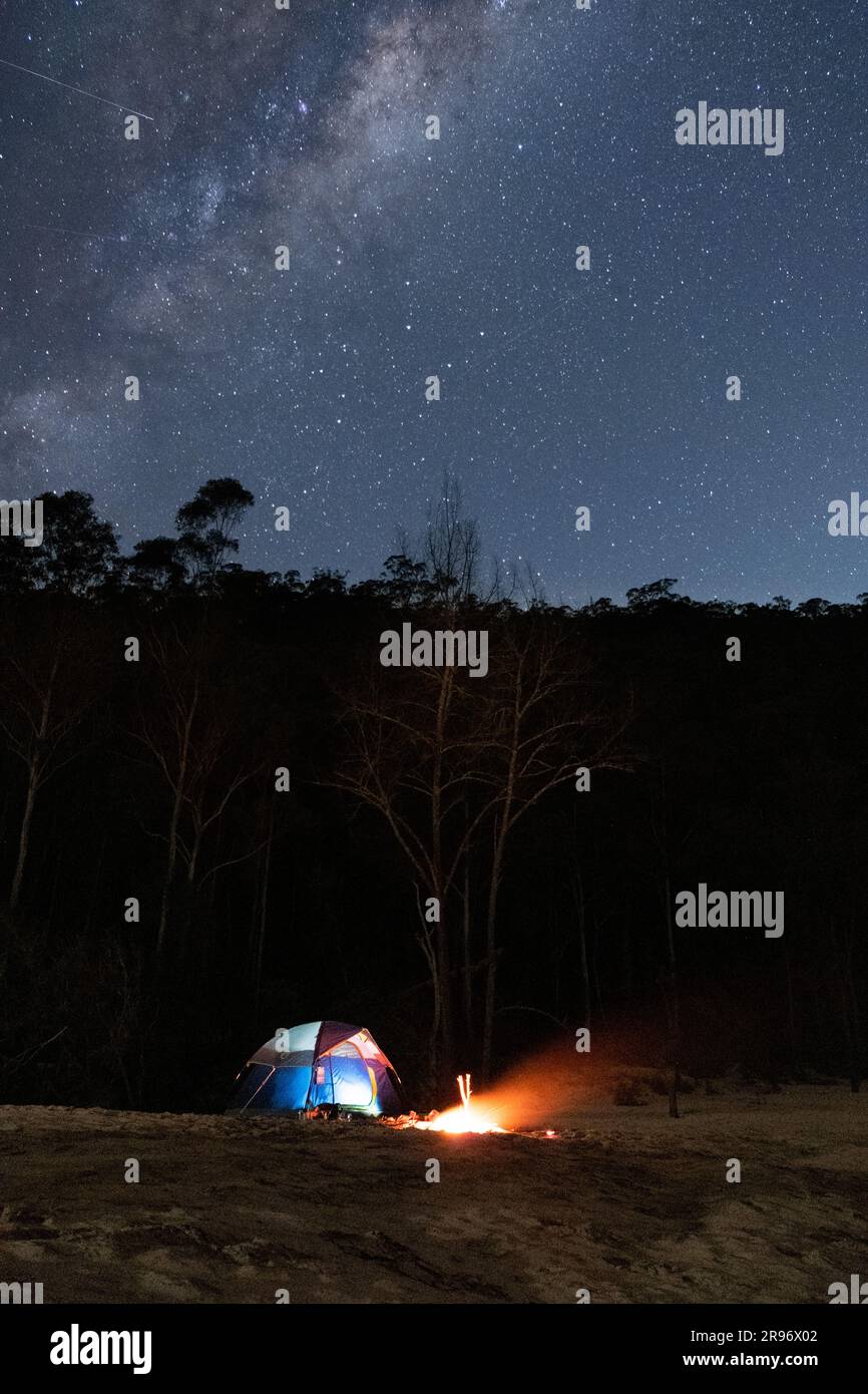 Camping long exposure photo of the Milky Way and tent on the beach in ...