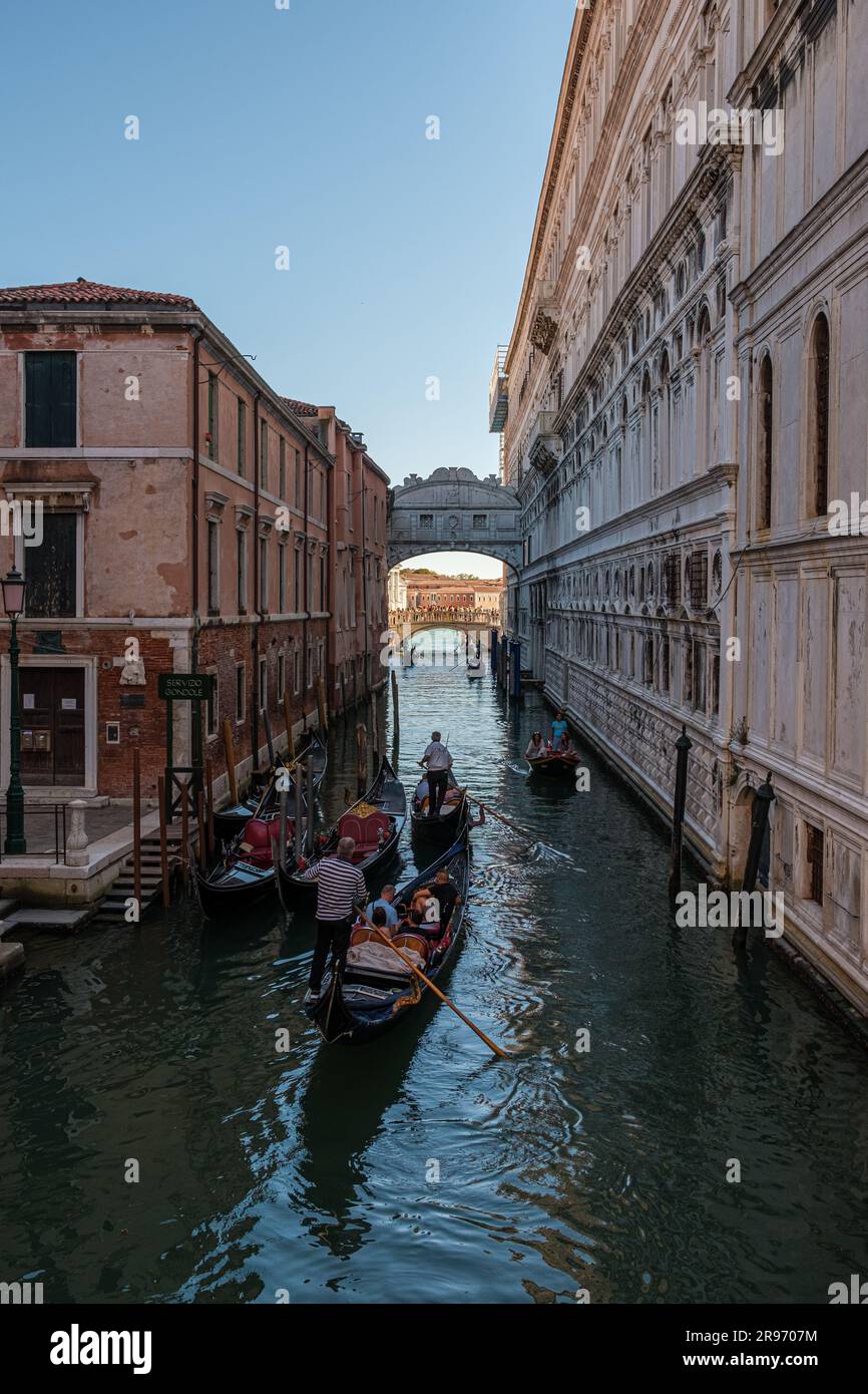 An Italian canal, showing the narrow waterways and gondolas bobbing in ...