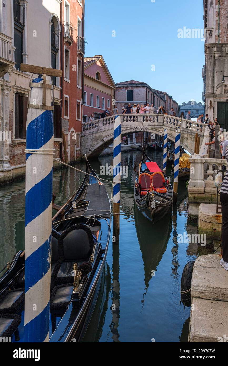 An Italian canal, showing the narrow waterways and gondolas bobbing in ...