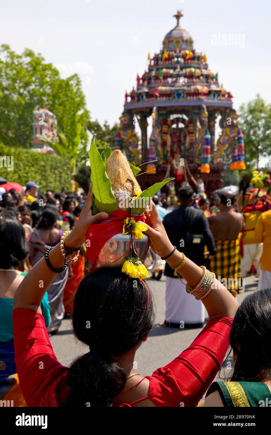 Woman in sari with offerings to the goddess on the main festival day at ...