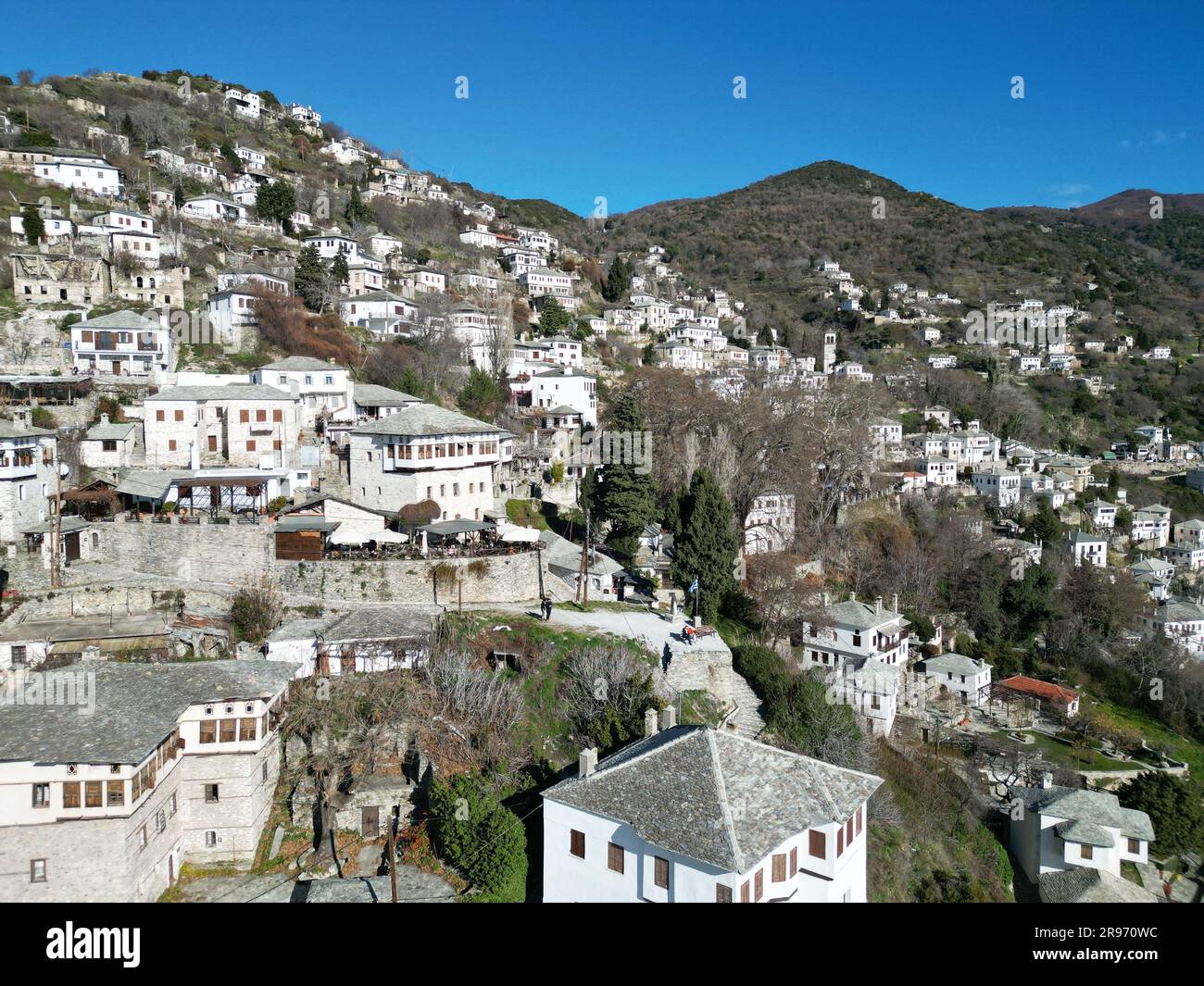 A picturesque town of Makrinitsa, Pelio, Greece, surrounded by rolling ...