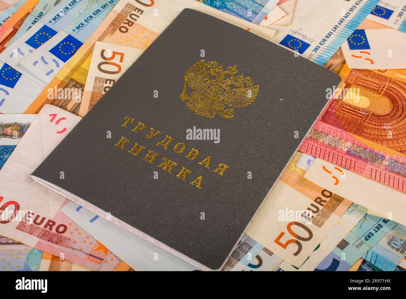 a small pile of paper euro bills as part of the trading system Stock ...