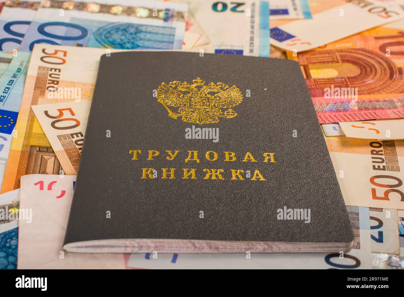 a small pile of paper euro bills as part of the trading system Stock ...