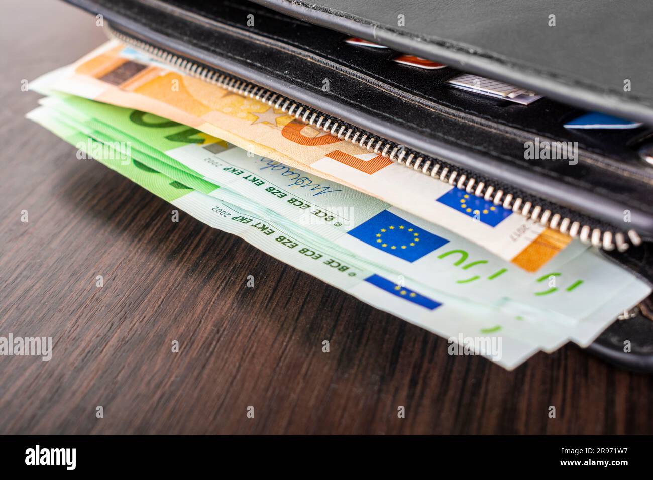 Open purse with euro cash denominations of denomination 10 20 50 100 on ...