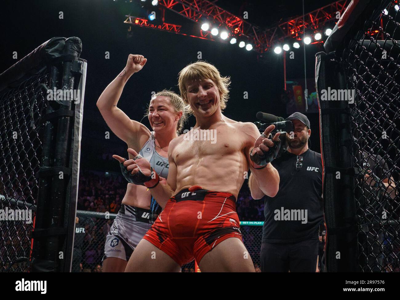 Paddy 'the Baddy' Pimblett of England celebrates his win with Molly ...