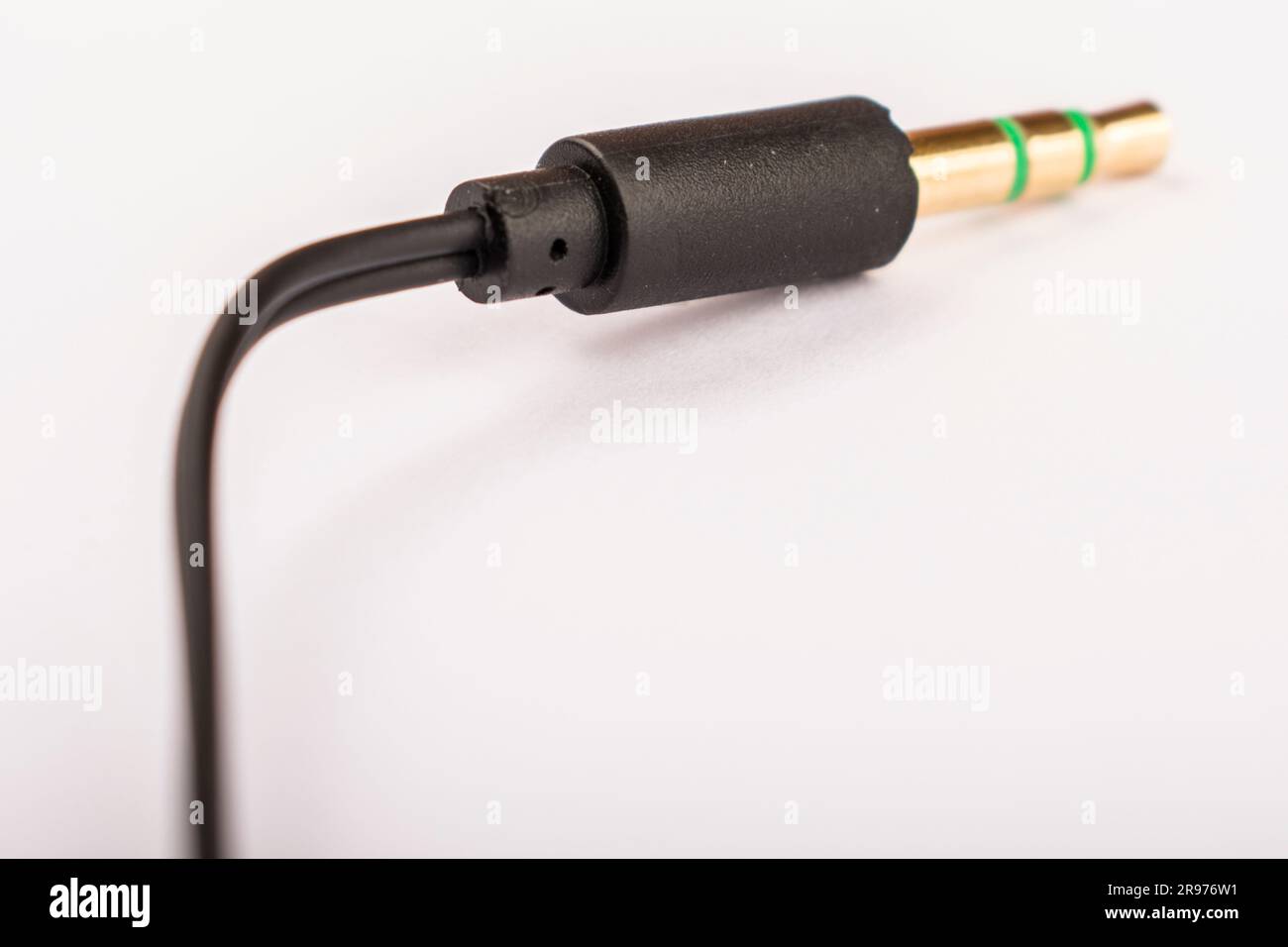 3.5mm headphone jack with wire lies on a white background isolate Stock Photo - Alamy