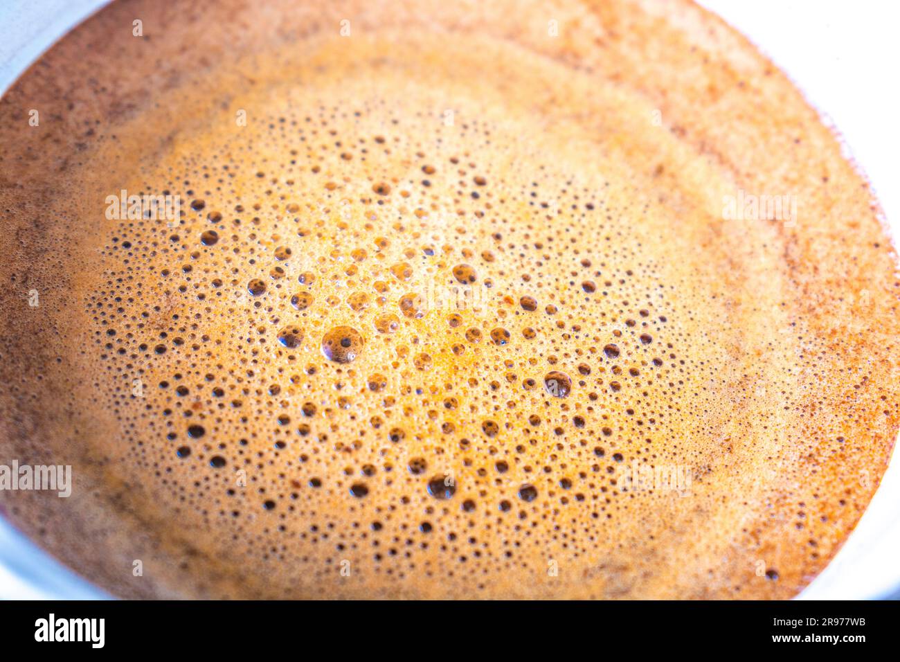 cream of coffee on top of a warm color Stock Photo - Alamy