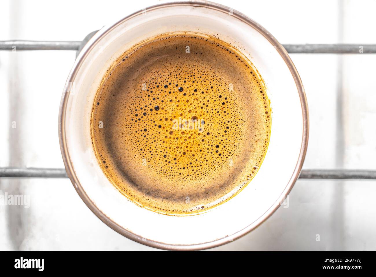 cream of coffee on top of a warm color Stock Photo - Alamy