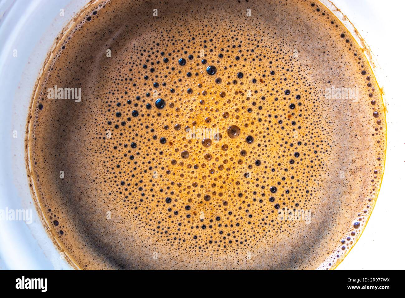 cream of coffee on top of a warm color Stock Photo - Alamy