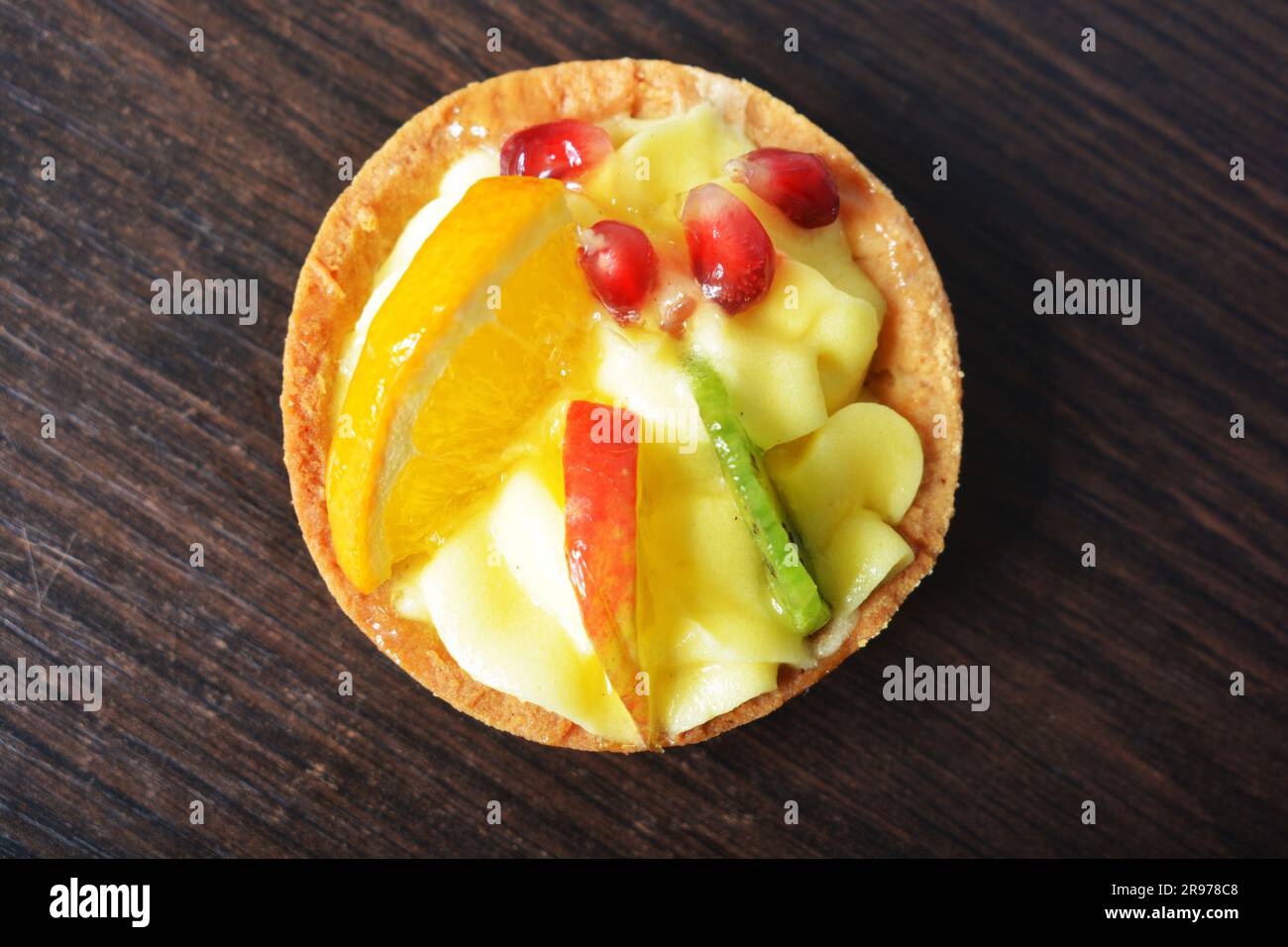 cream cake with colored fruit in a basket Stock Photo - Alamy
