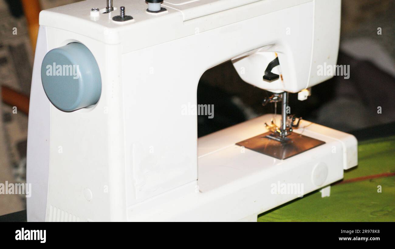 sewing machine and item of clothing Stock Photo - Alamy