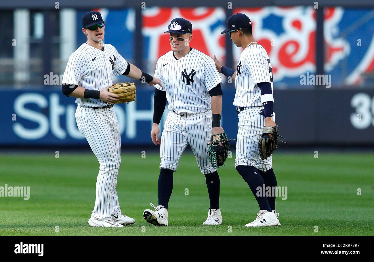 New York Yankees Billy McKinney, left, Harrison Bader, center, and ...