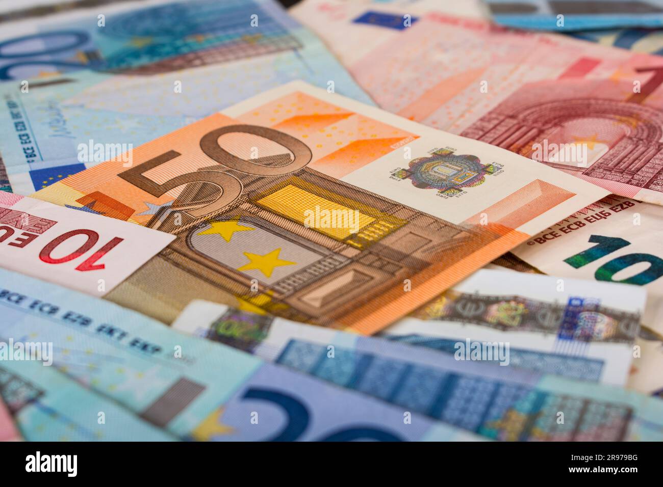 a small pile of paper euro bills as part of the trading system Stock ...