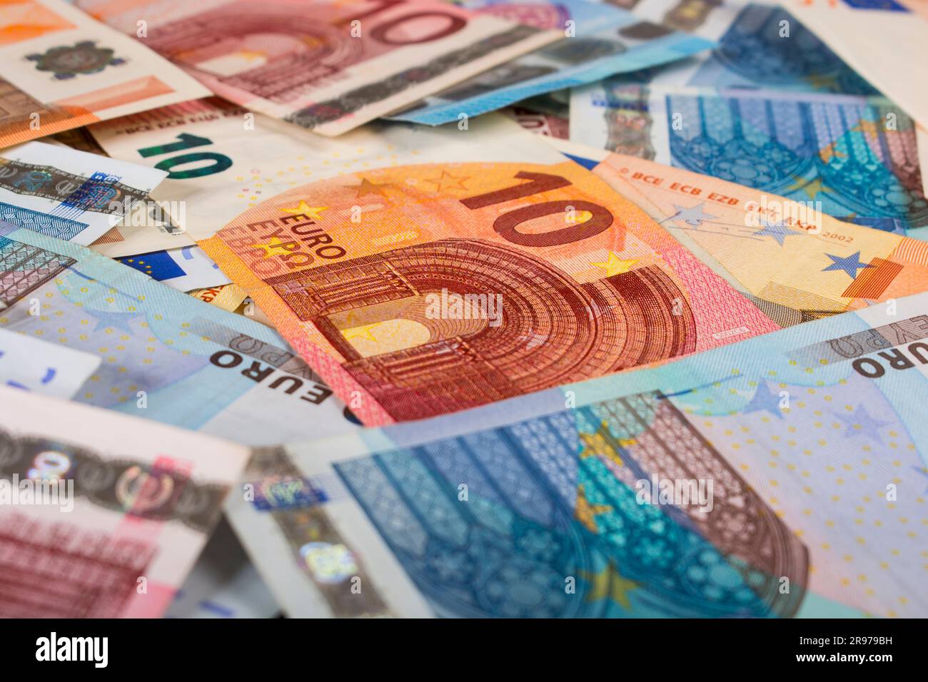 a small pile of paper euro bills as part of the trading system Stock ...
