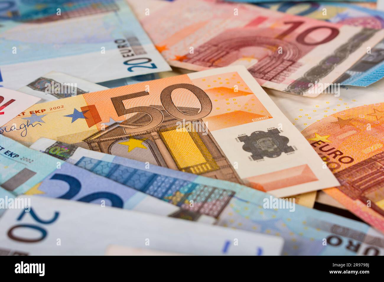 a small pile of paper euro bills as part of the trading system Stock ...
