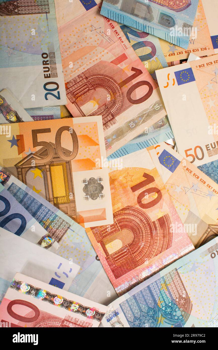 a small pile of paper euro bills as part of the trading system Stock ...