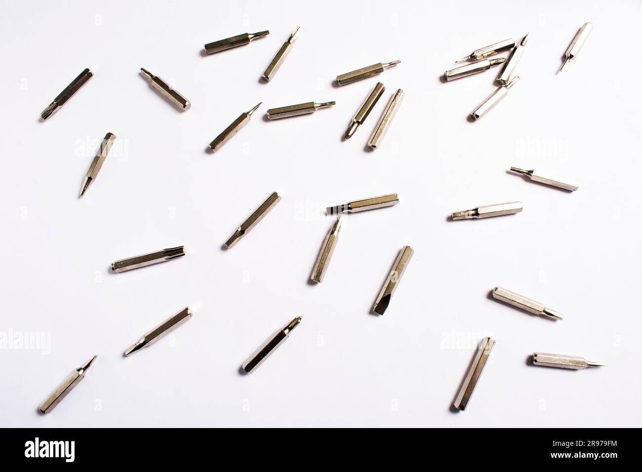 different bits for screwdrivers scattered on white background Stock ...