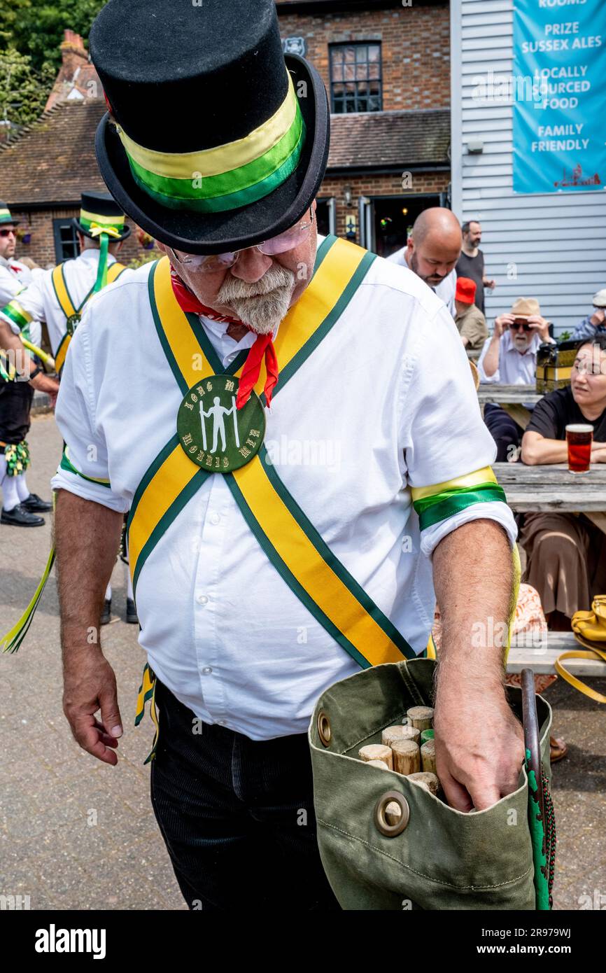 A Long Man Morris Dancer Selects a A Stick To Use For A Traditional ...