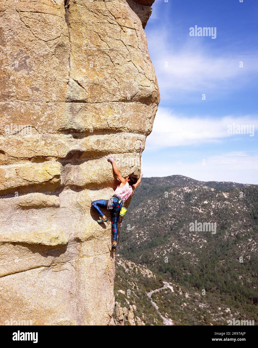 Adult male rock climber ascends a granite face in the Santa Catalina ...