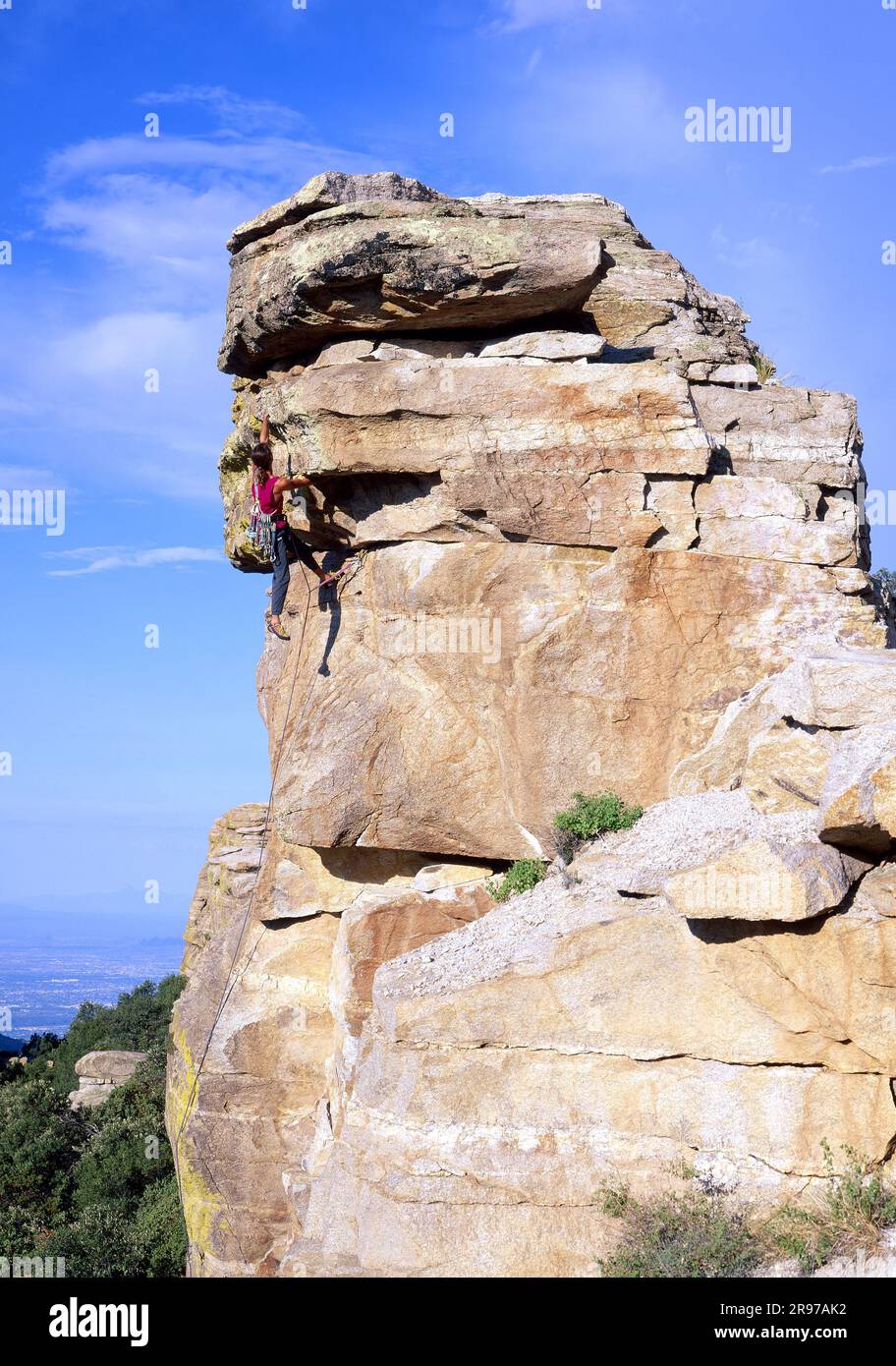 Adult male rock climber ascends a granite face in the Santa Catalina ...