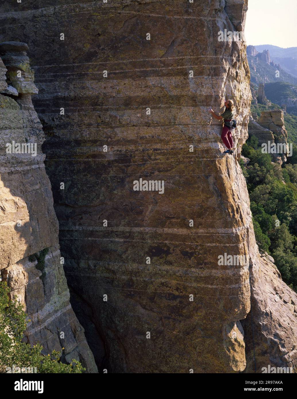 Adult male rock climber ascends a granite face in the Santa Catalina ...