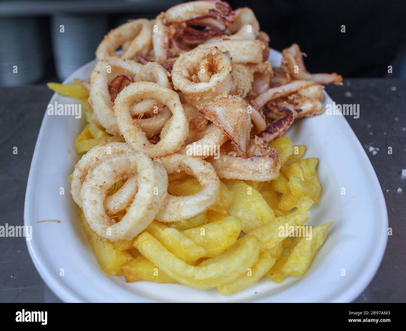 fried calamari and chips ready to be eaten for dinner Stock Photo - Alamy