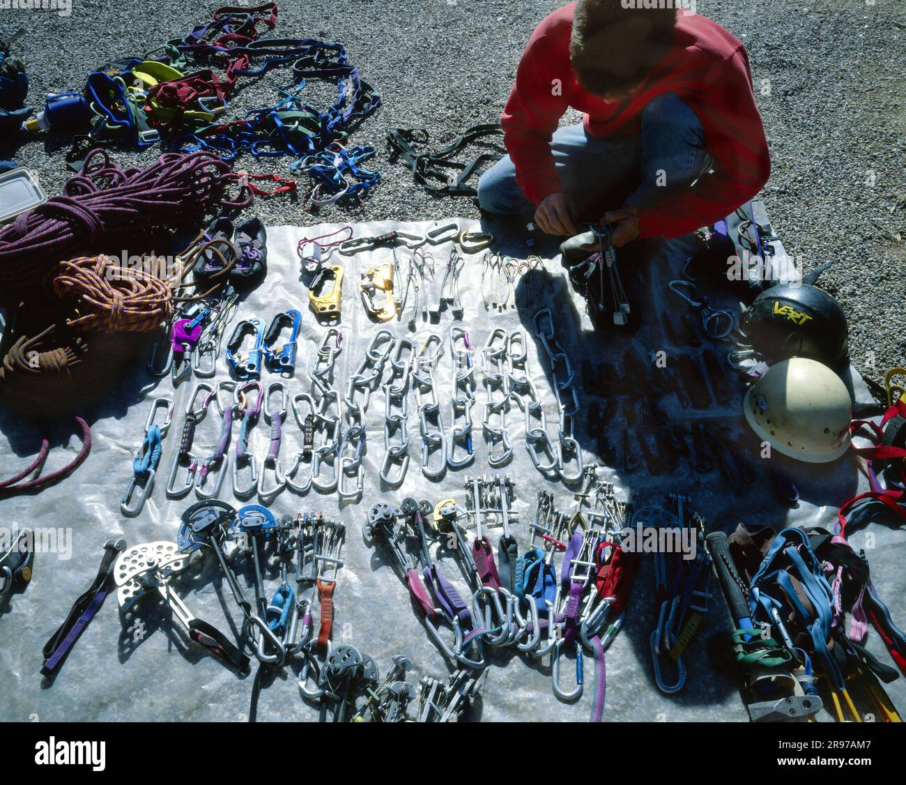 Single male rock climber takes stock on climbing equipment. Tucson ...