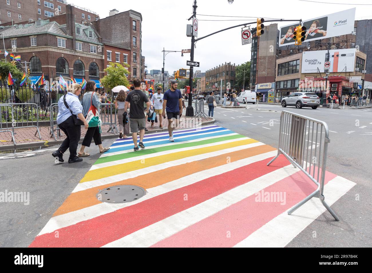 A crosswalk is decorated in rainbow colors in honor of LGBTQIA pride ...