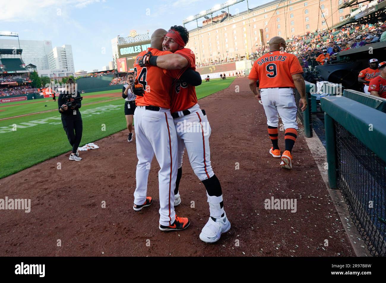 Baltimore Orioles' Ryan McKenna, center right, hugs teammate Aaron ...