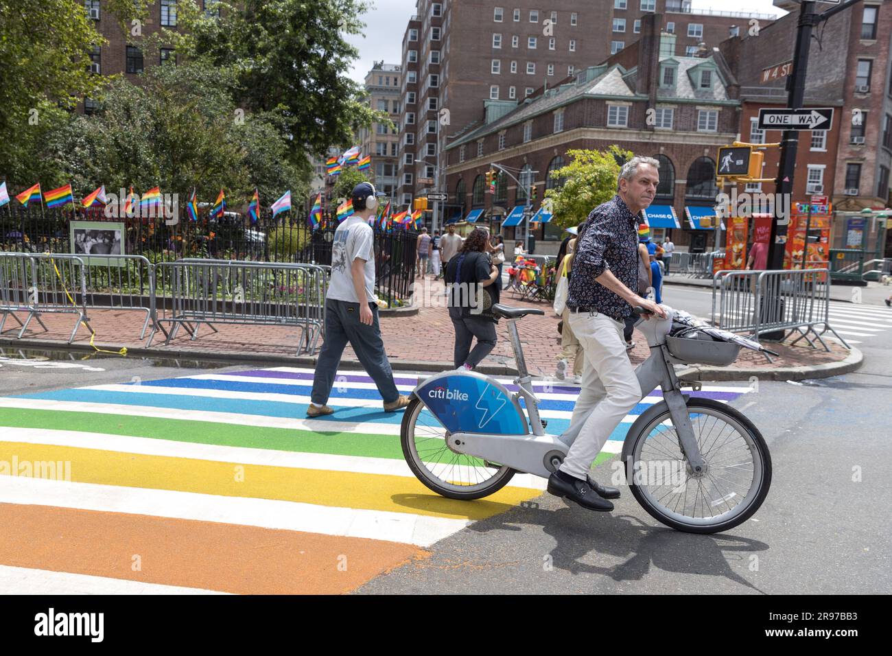 A crosswalk is decorated in rainbow colors in honor of LGBTQIA pride ...