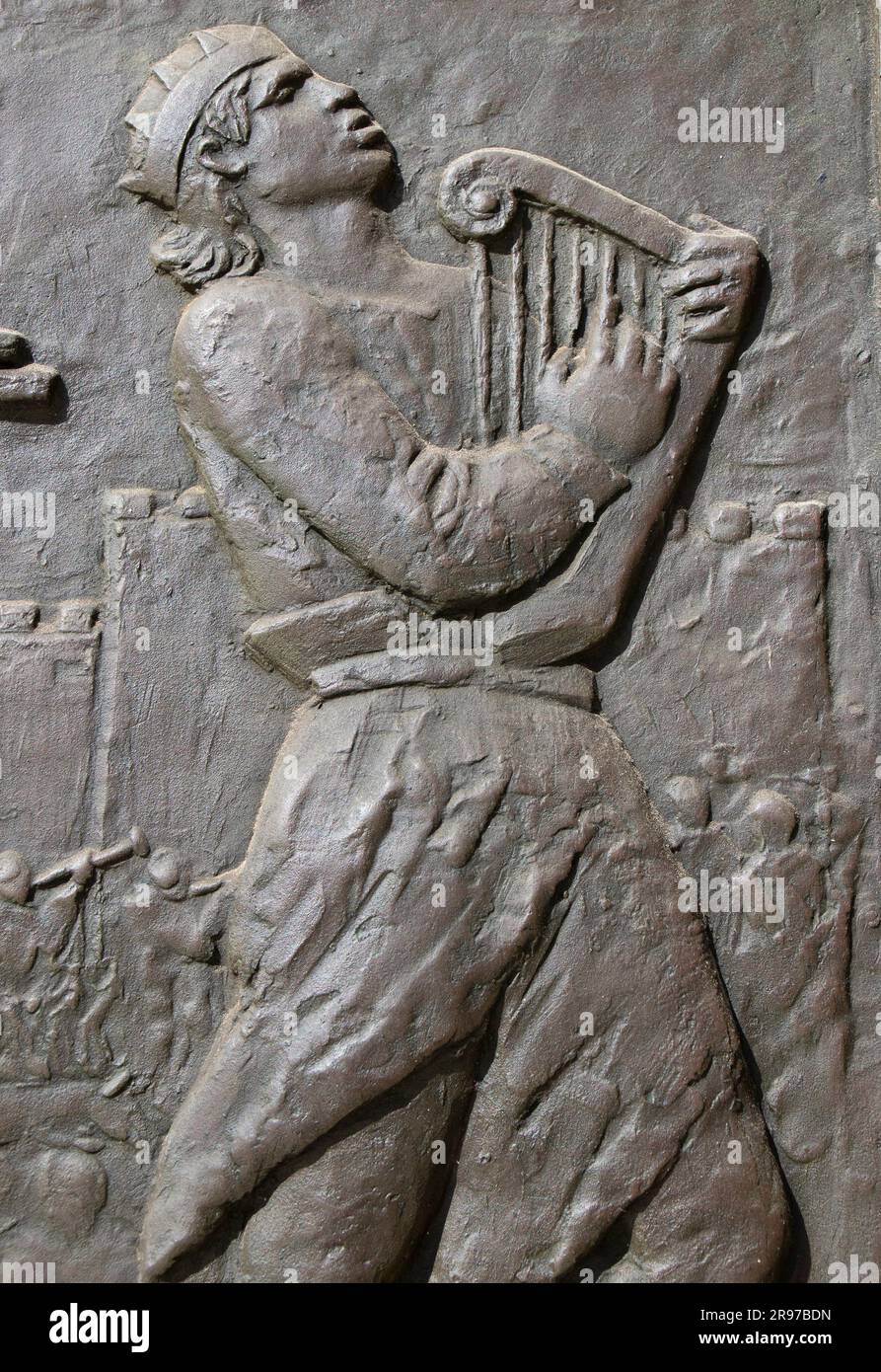 Relief of a young man playing ancient harp while walking, on the Lions ...